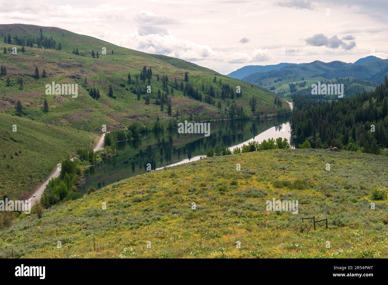 Patterson Lake settles in a valley between green foothills of the North ...