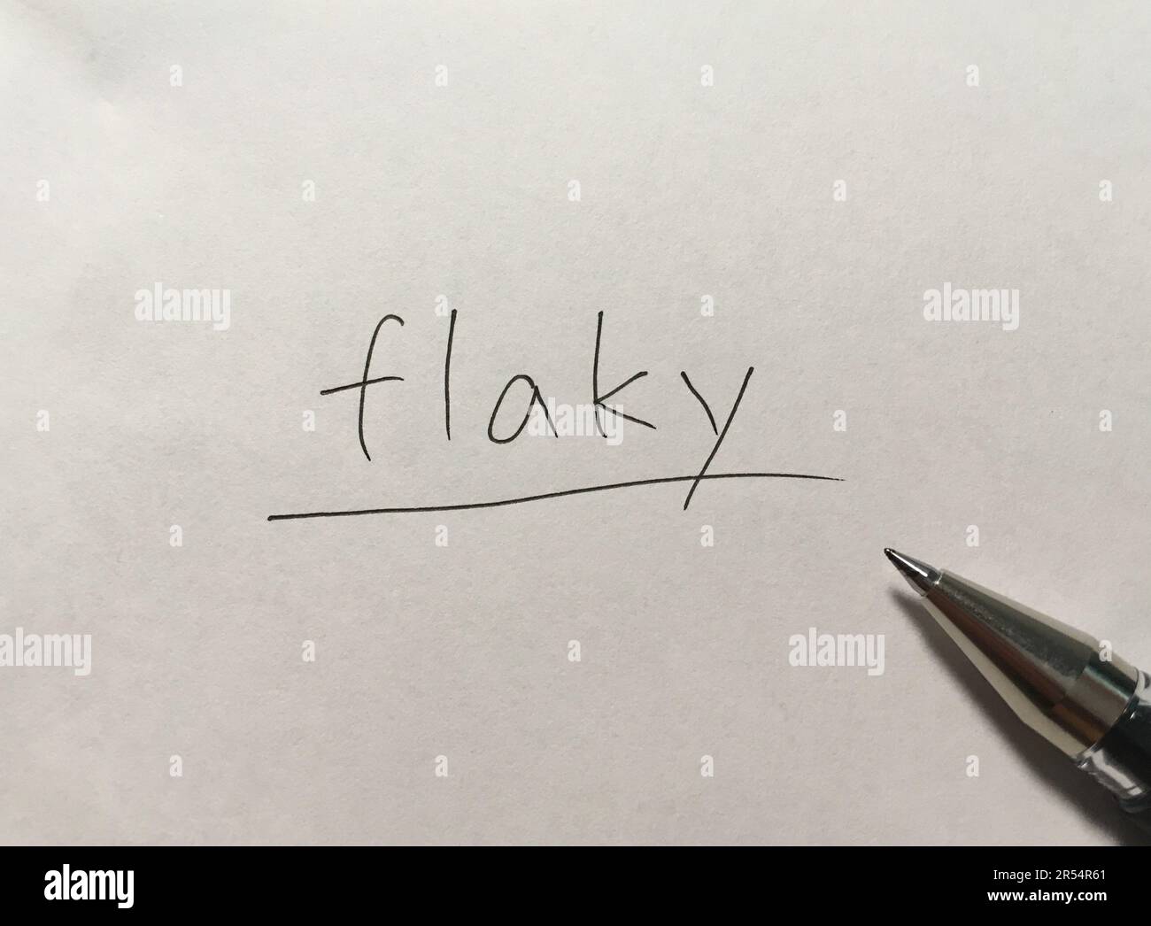 Flaky concept word on paper background Stock Photo - Alamy