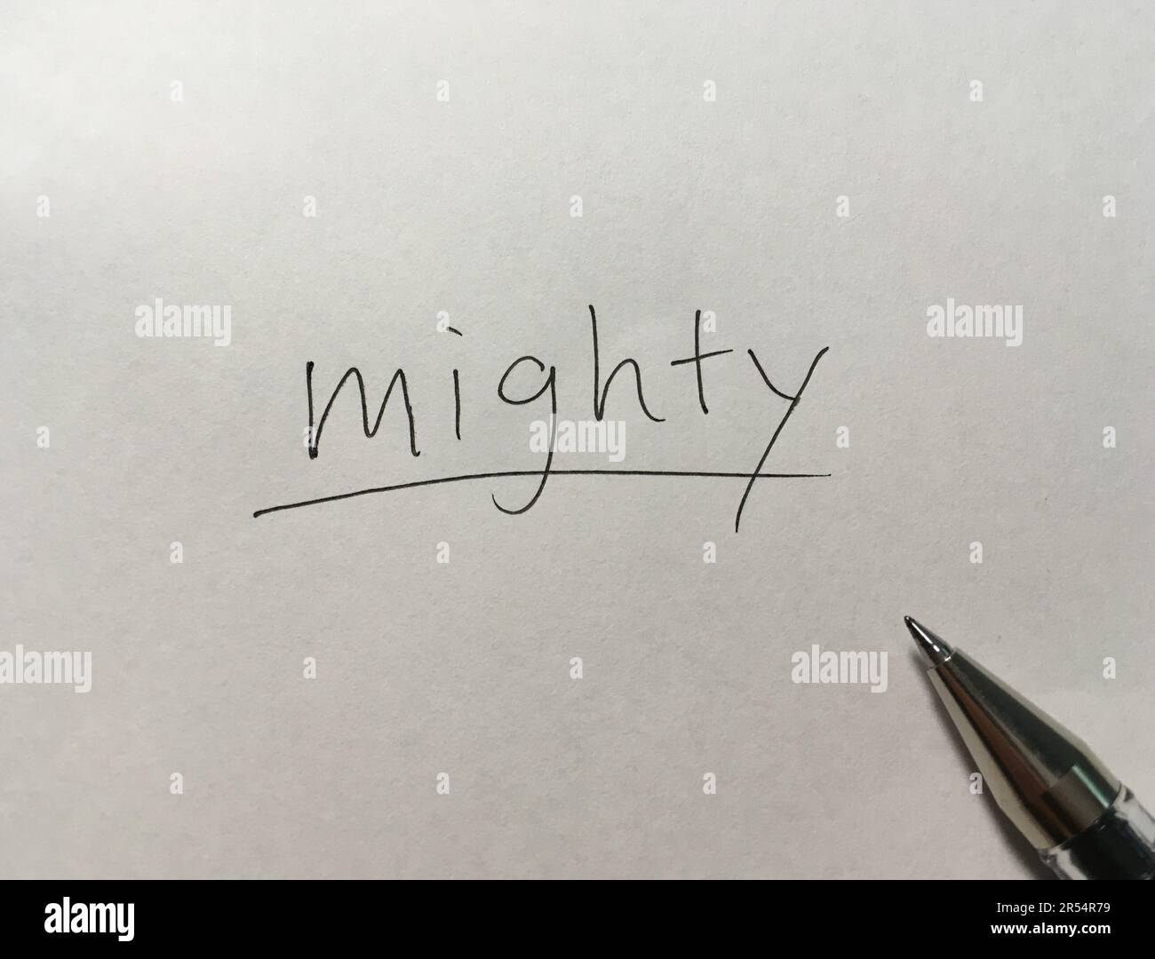 Mighty concept word on paper background Stock Photo - Alamy