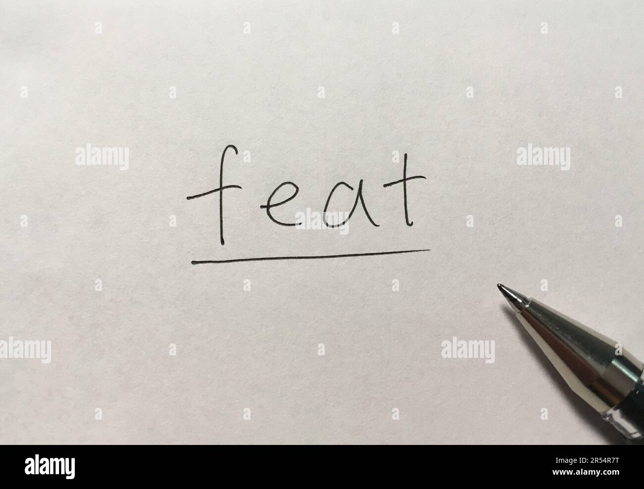 Feat concept word on paper background Stock Photo - Alamy