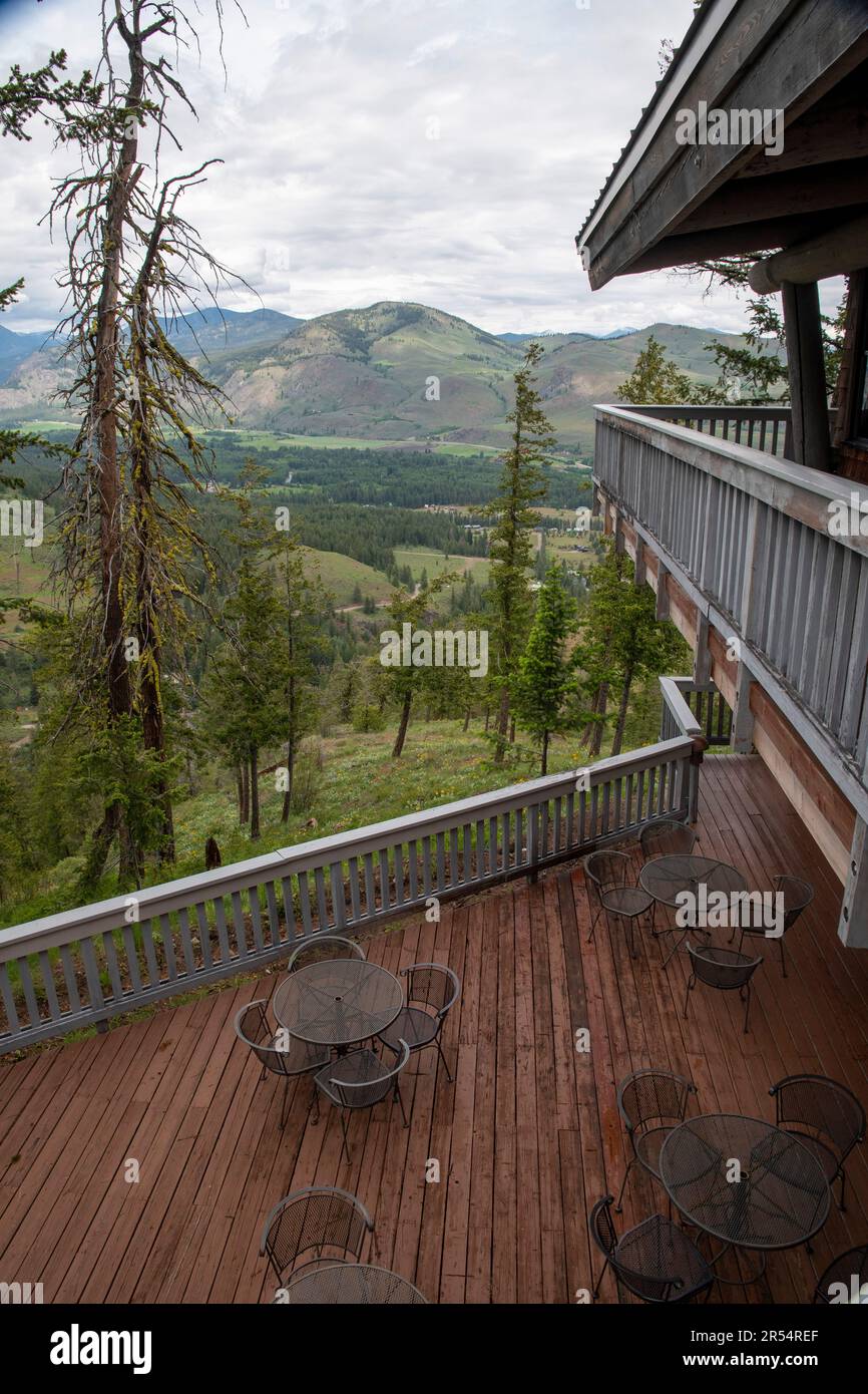 Outdoor dining tables overlook the Methow Valley, as seen from the deck ...