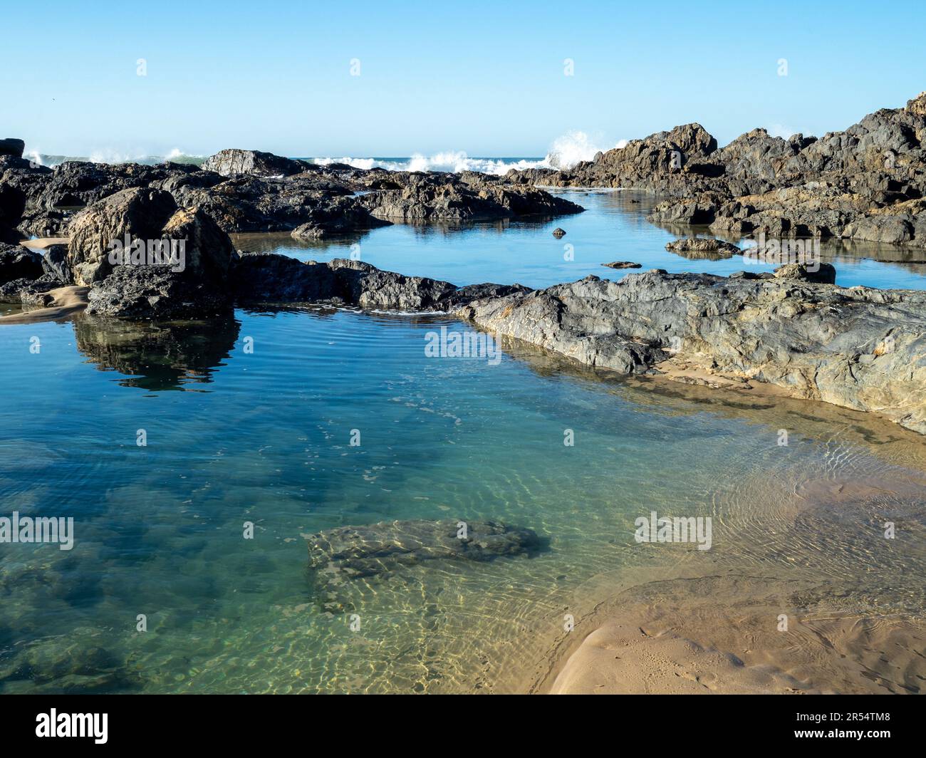 Stunning colours of blue and green in this calm seascape of rock pools ...