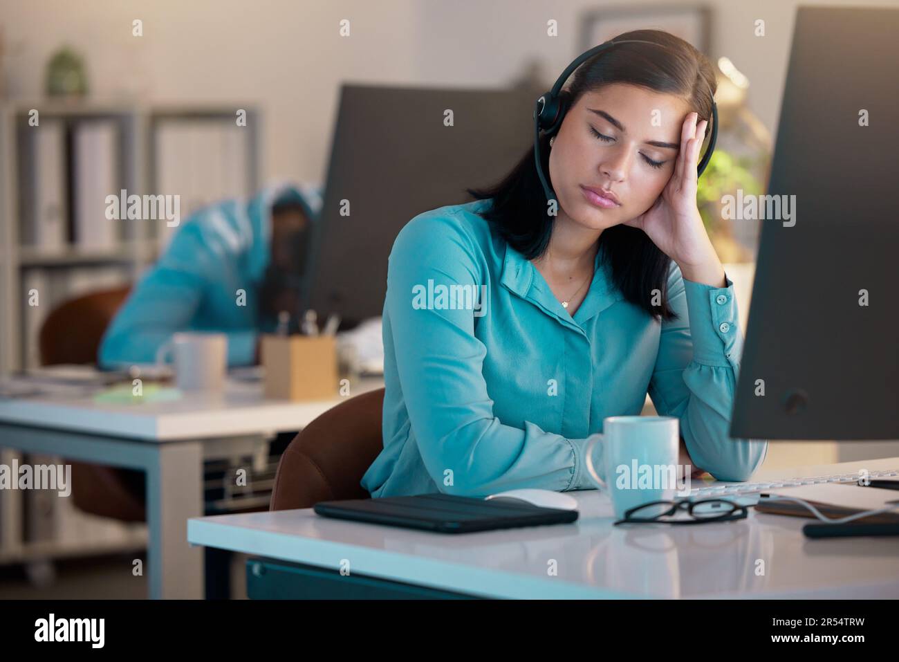 Call center, sleeping and tired woman in office for customer service or ...