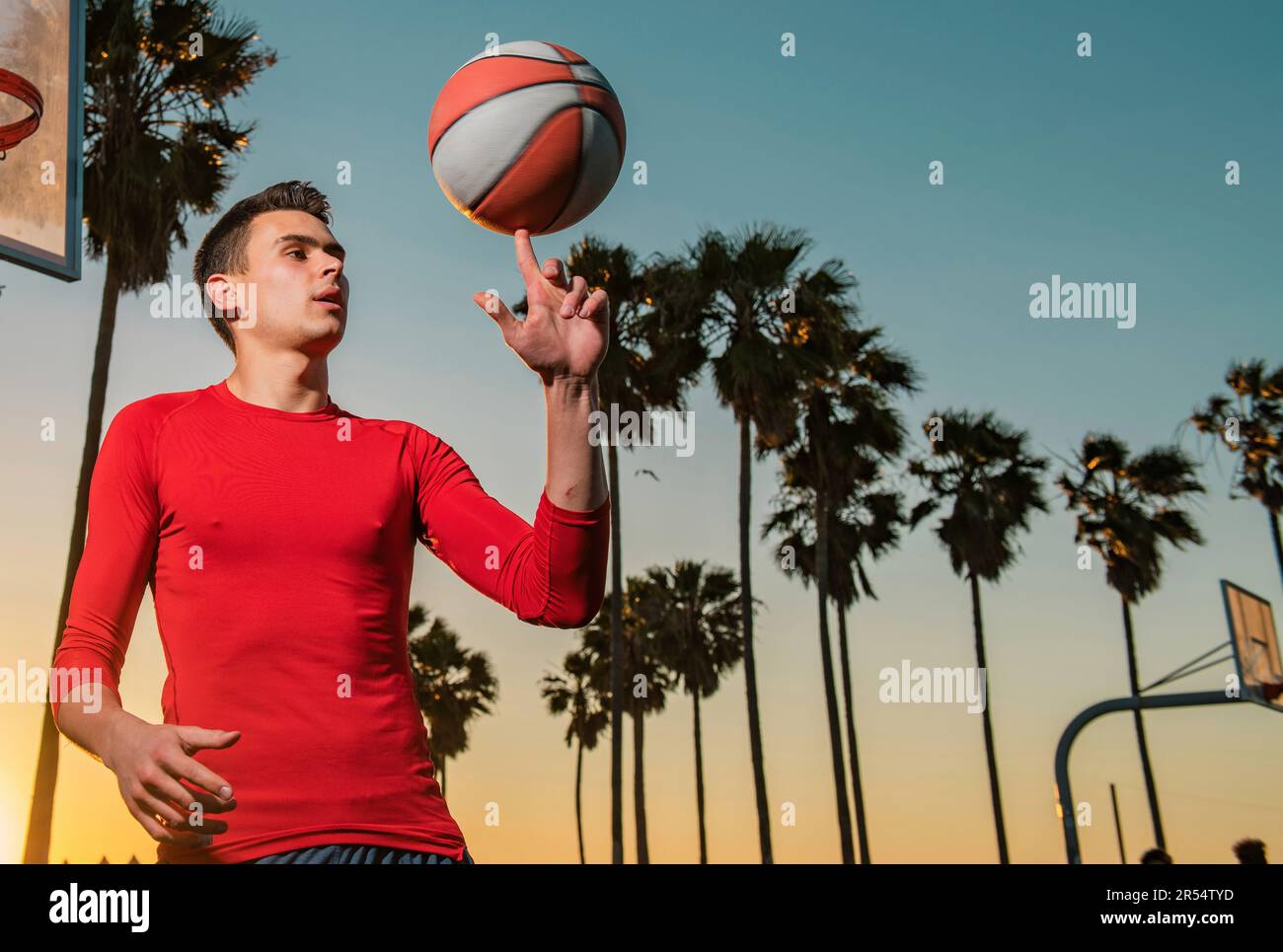 Basketball player. Hand spinning basket ball. Balancing basketball on ...