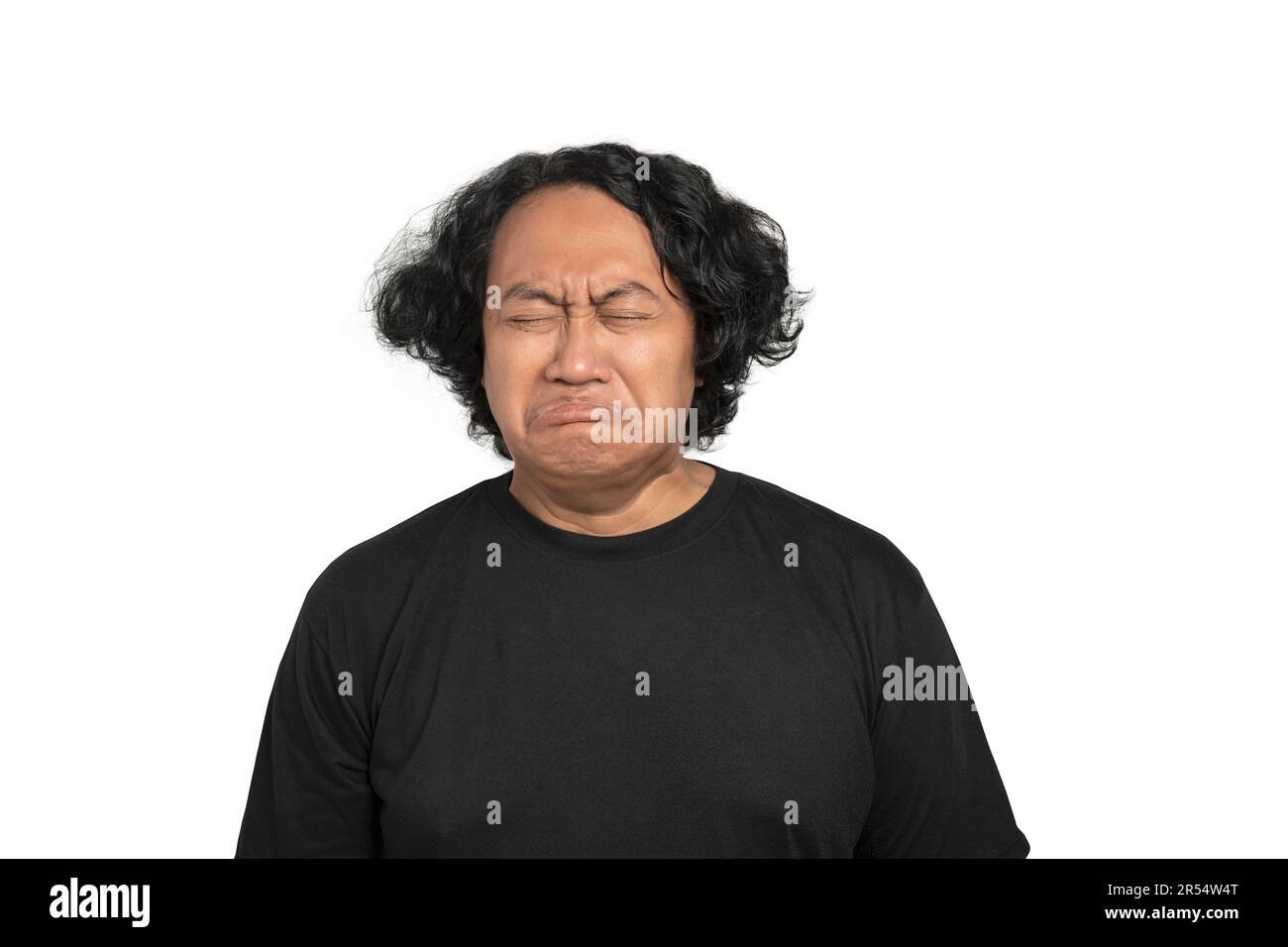 Portrait of an Asian man with a sad facial expression isolated over ...