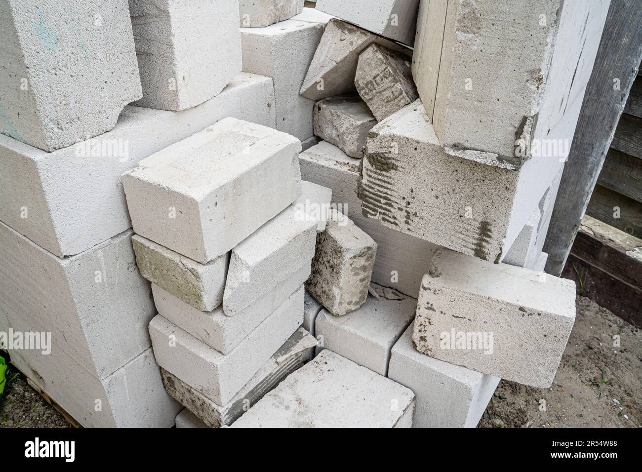 Scraps and pieces of aerated concrete blocks, close-up. Residues and ...