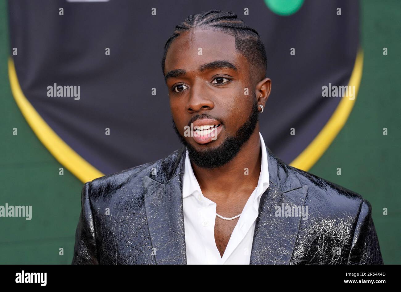 Caleb McLaughlin poses at the premiere of the Peacock film "Shooting ...