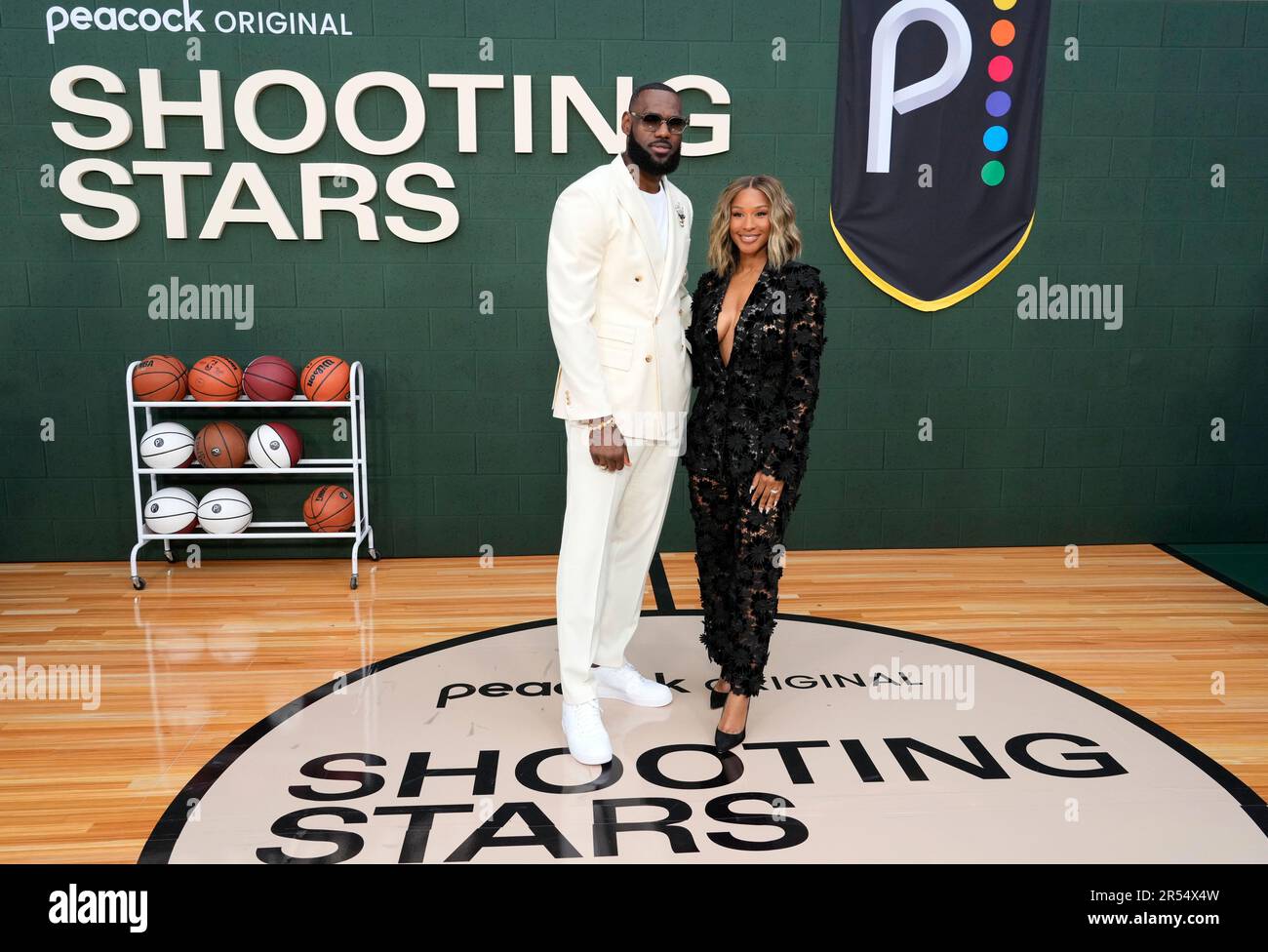 LeBron James and his wife Savannah pose together at the premiere of the Peacock film "Shooting ...