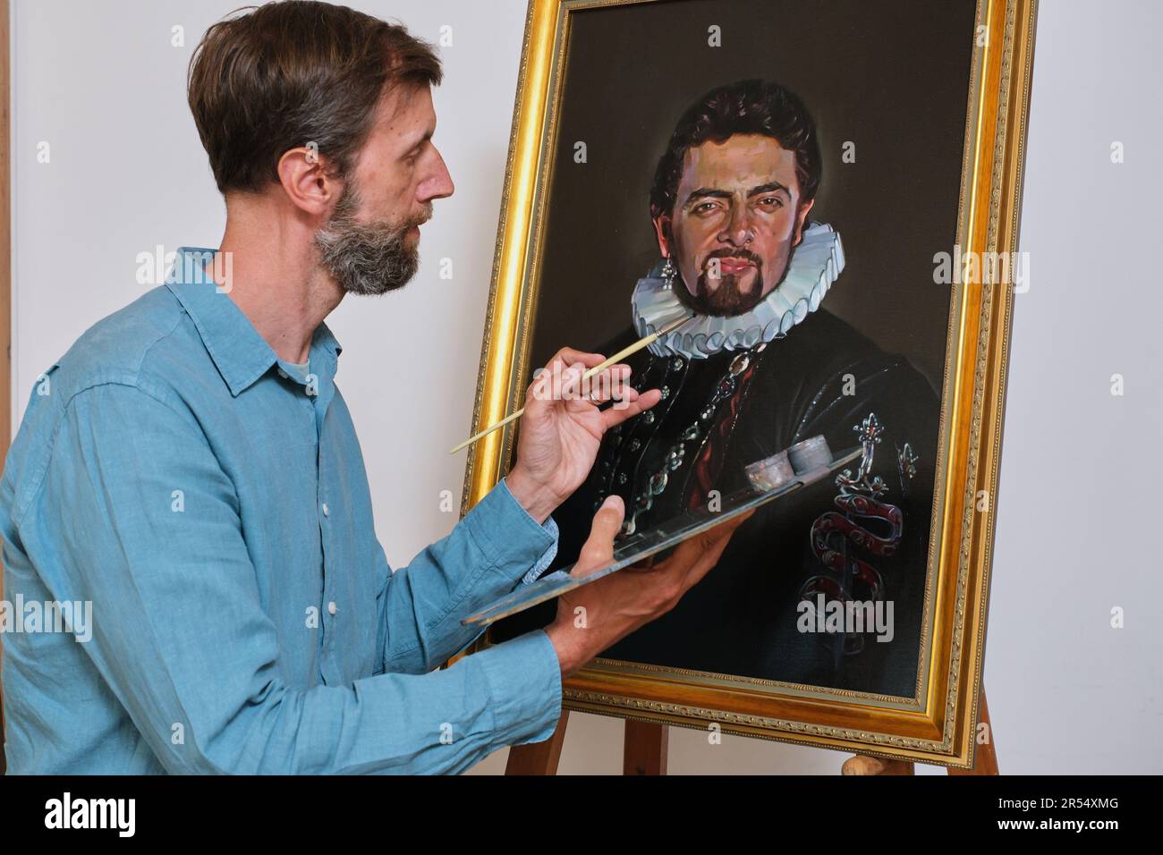 EDITORIAL USE ONLY Artist Tom Croft adds finishing touches to an oil ...