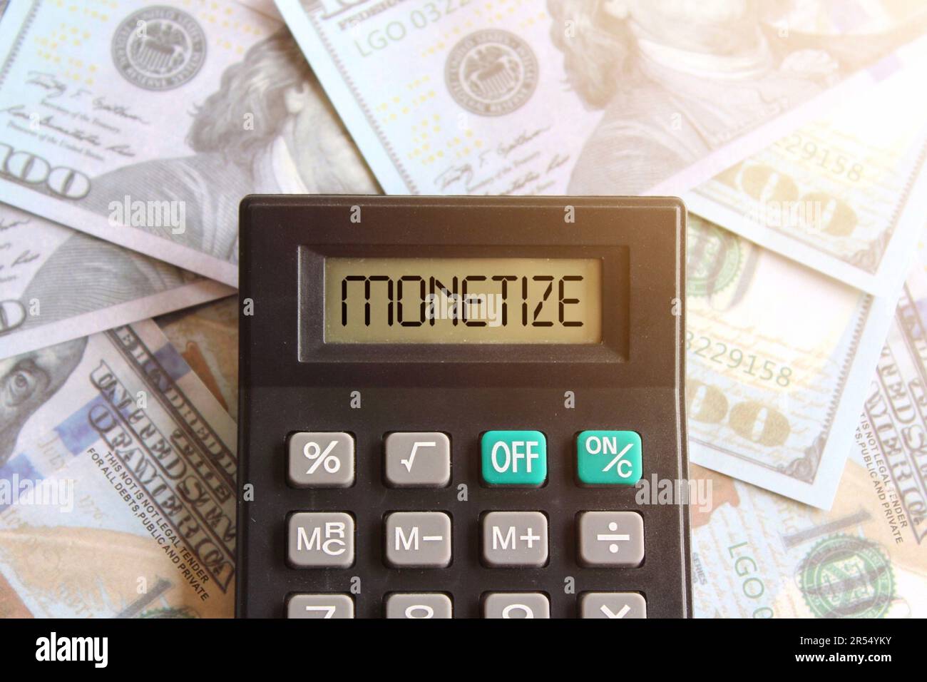 Top view image of calculator with text MONETIZE on display and money ...