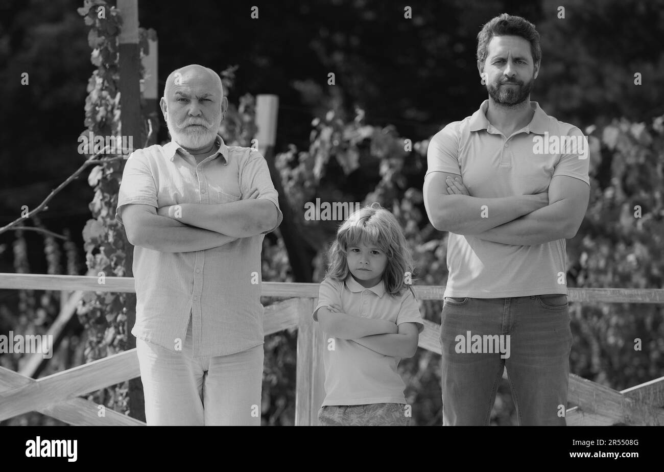 Men generation grandfather father and son are in garden. Fathers day ...