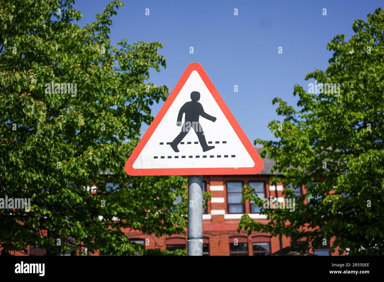 Pedestrian crossing sign, England, UK Stock Photo - Alamy