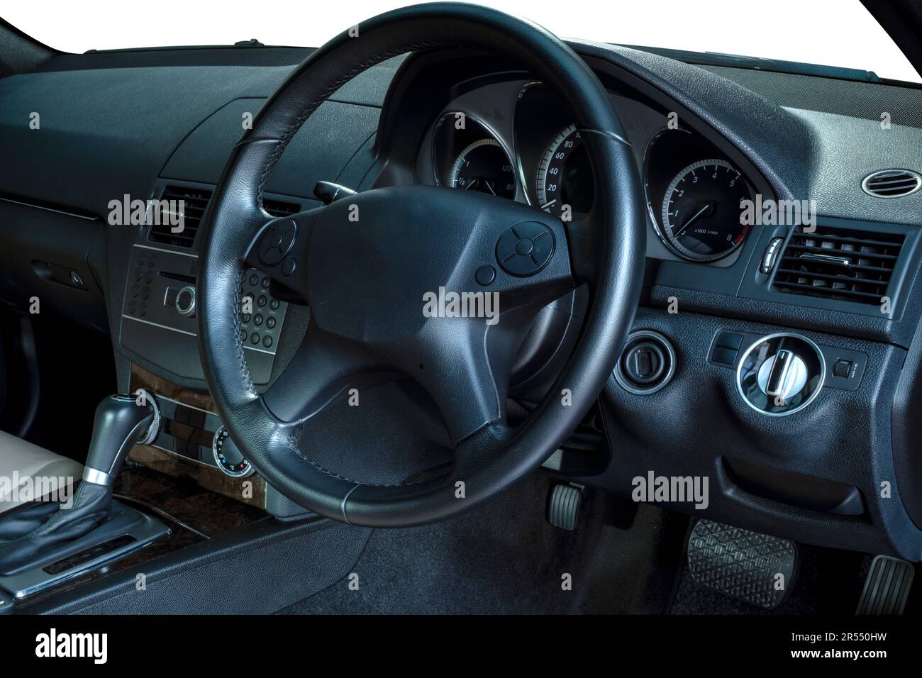 Steering wheel, shift lever, dashboard, speedometer display. Modern car ...
