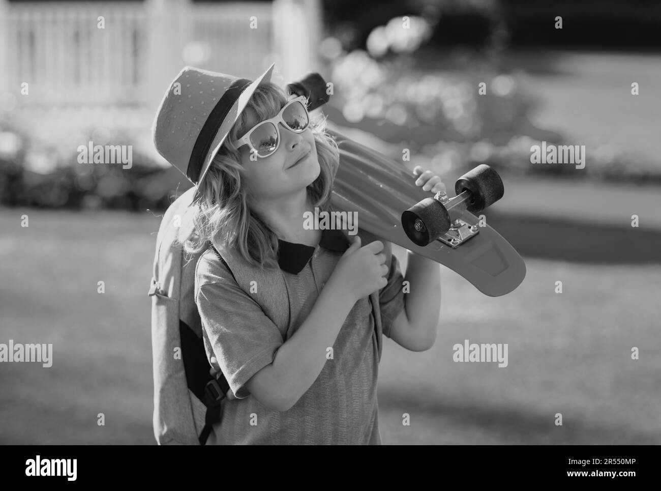 Summer kids fashion. Kid with skateboard. Child hold skate board ...