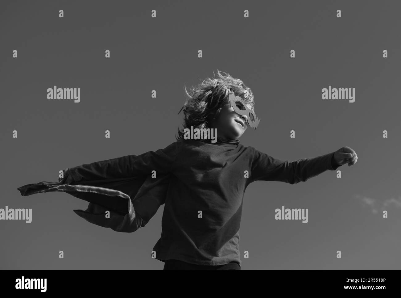 Super hero child in a red superhero coat. Super hero concept Stock ...