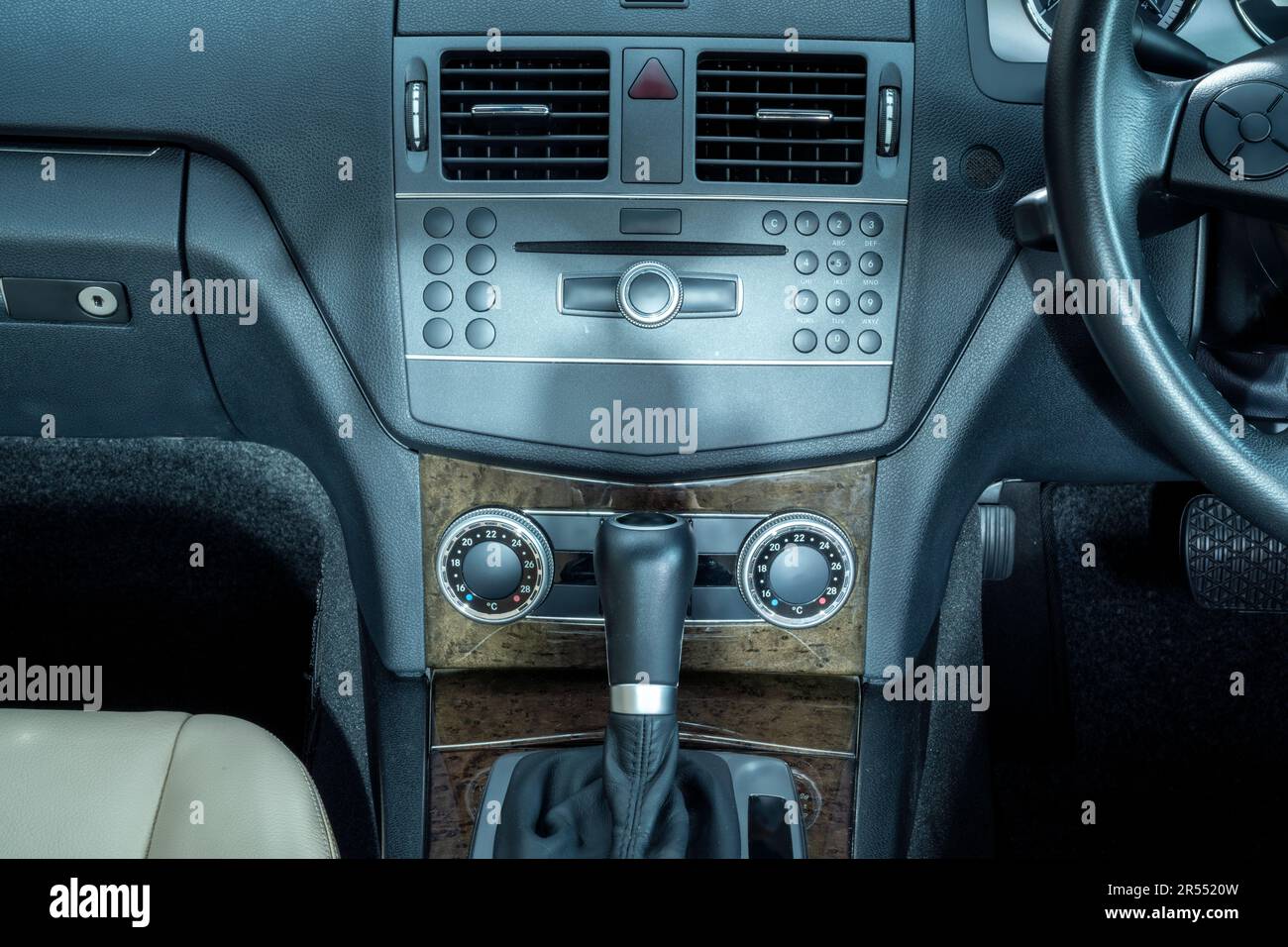 Steering wheel, shift lever, dashboard, speedometer display. Modern car ...