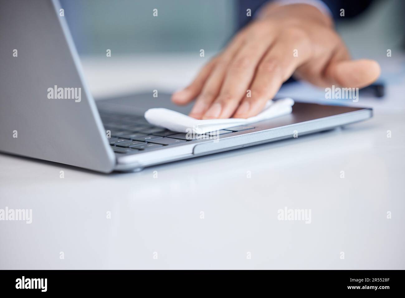Closeup, business and hands cleaning, laptop and wiping with hygiene ...