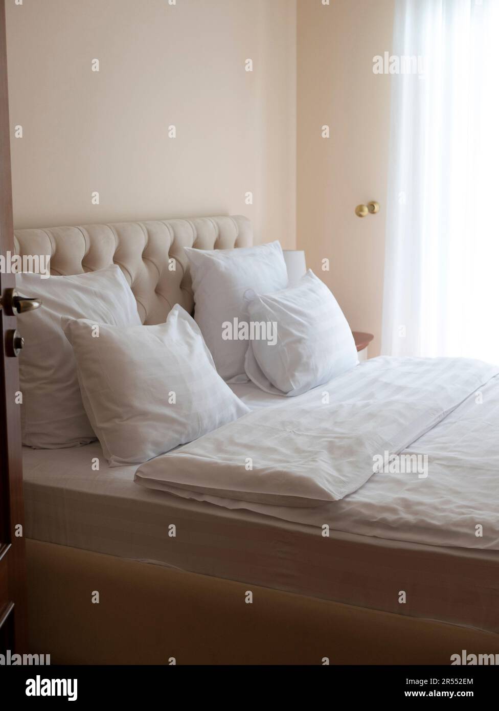 Sleeping area with a modern bed covered in snow-white linen. Bedroom ...