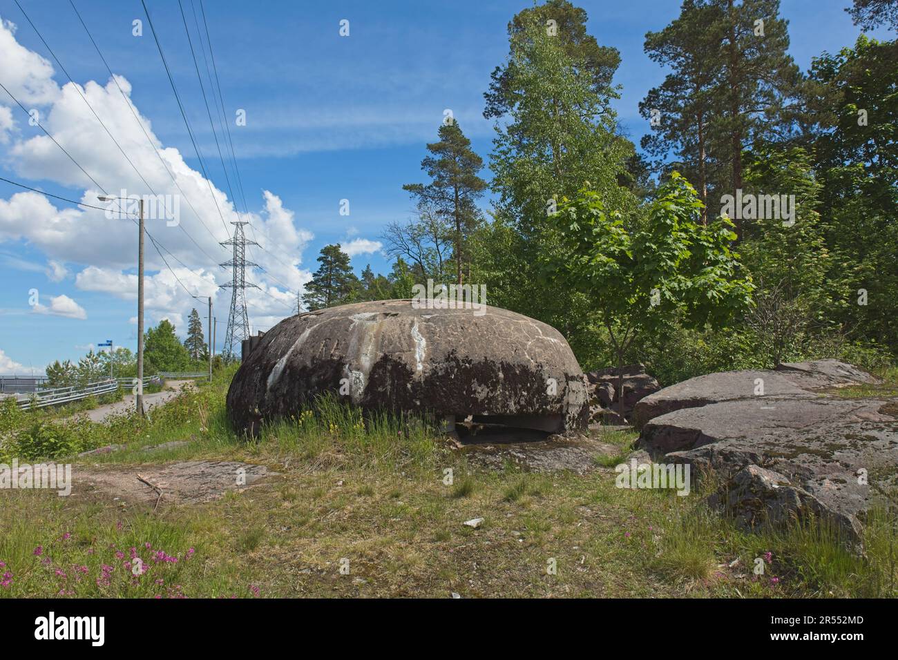 WW1 bunker with trees, grass and clouds in sky, Ruukinranta, Espoo ...