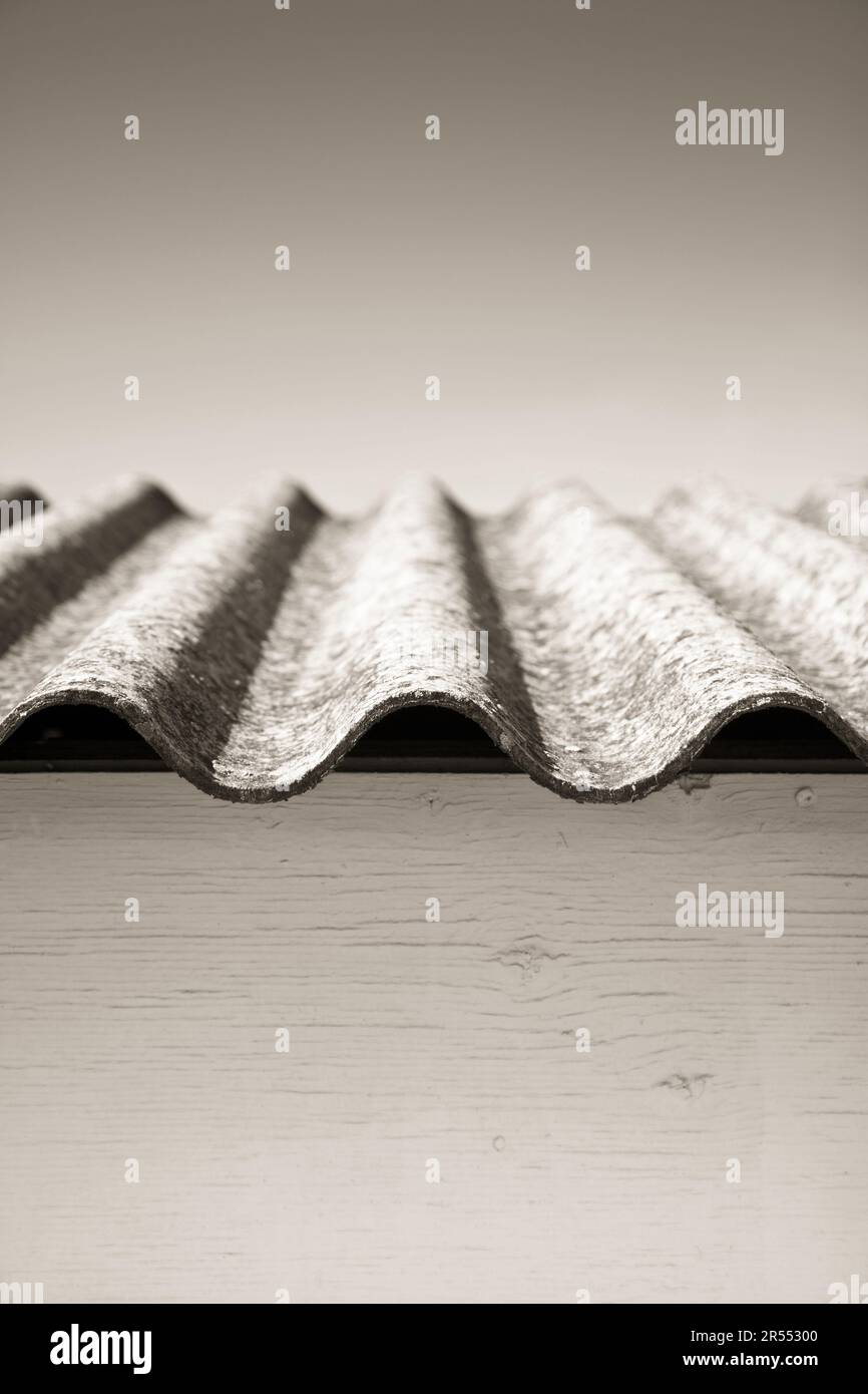 Old aged dangerous roof made of prefabricated corrugated panels with ...