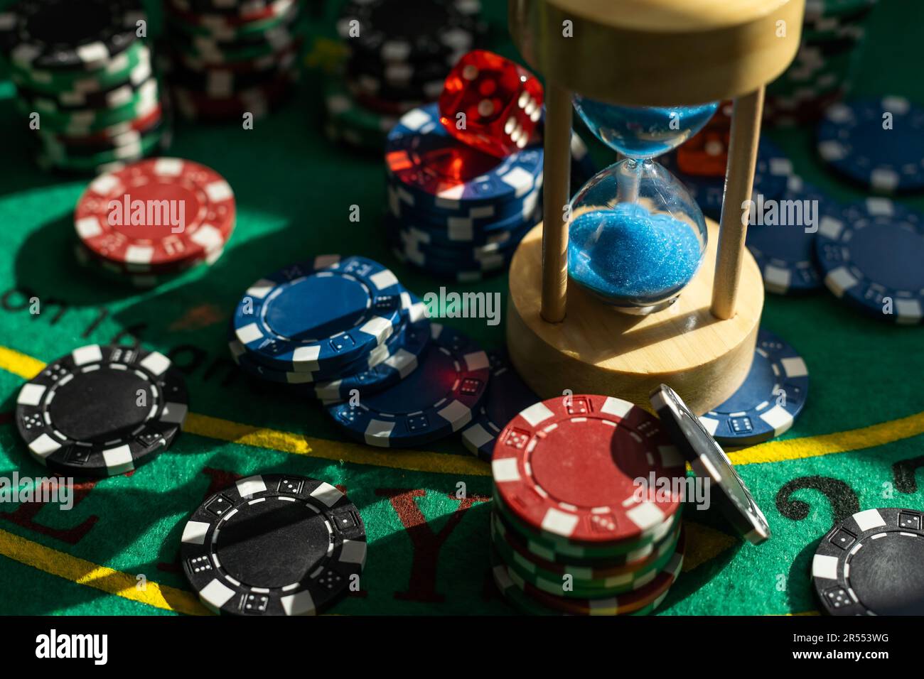 Poker Chips on a gaming table with dramatic lighting Stock Photo - Alamy