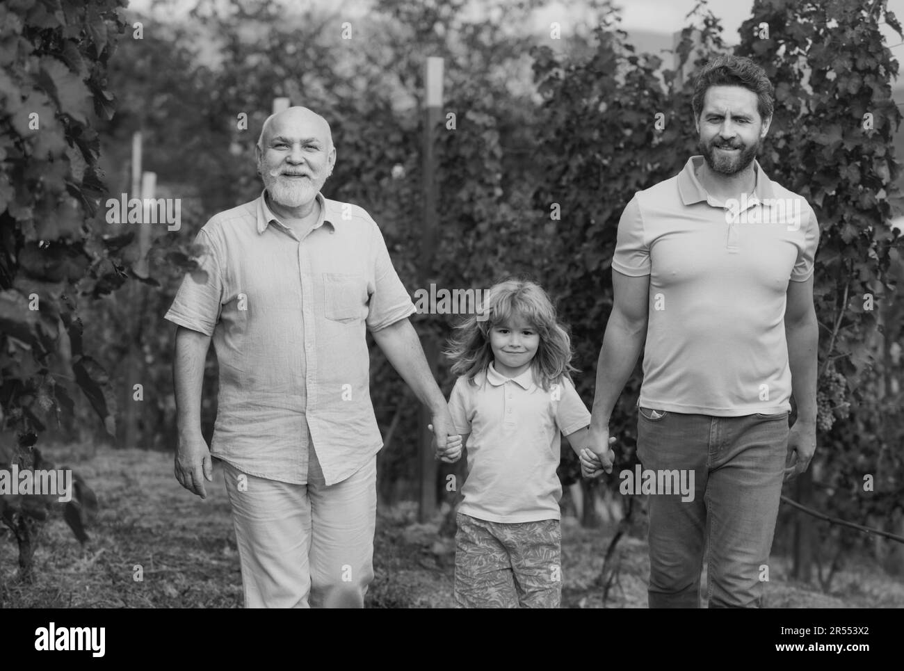 Male generation family walking together with three different ...