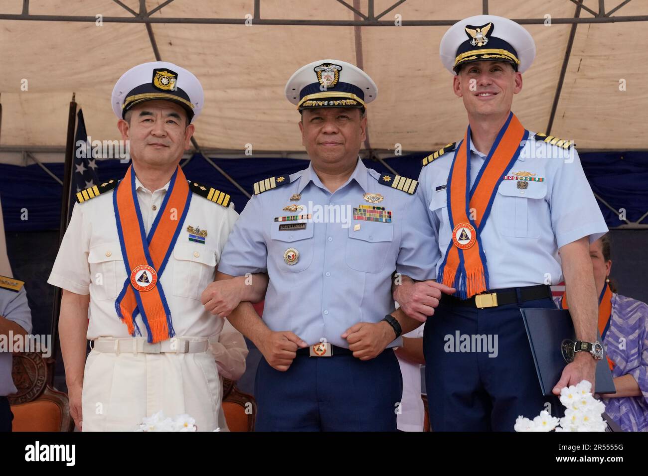 From left, Japanese Coast Guard Commanding Officer of Akitsushima ...