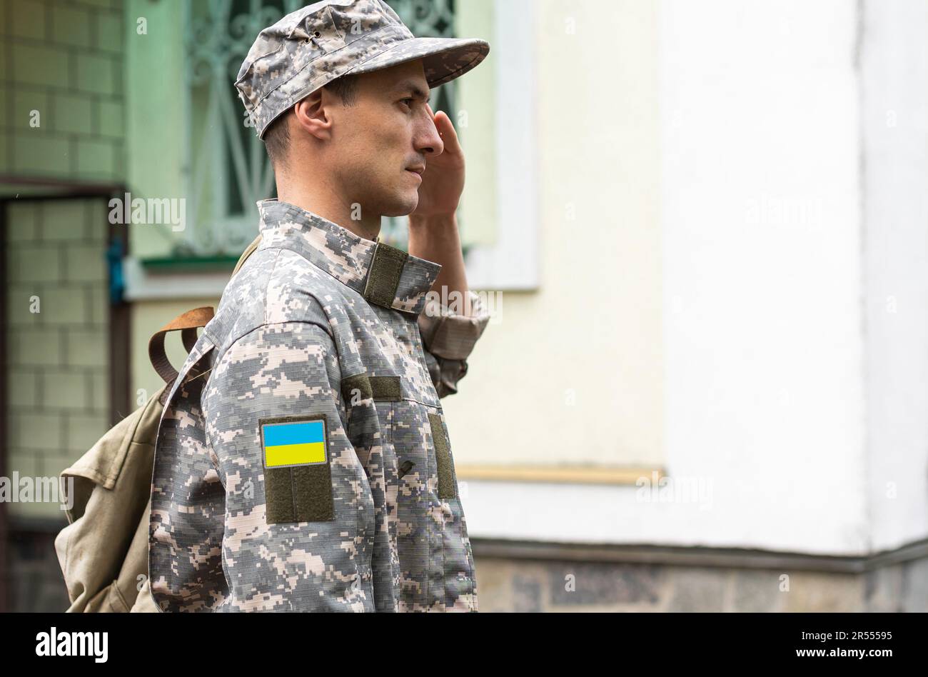 Ukrainian soldier wearing military uniform with flag and chevron ...