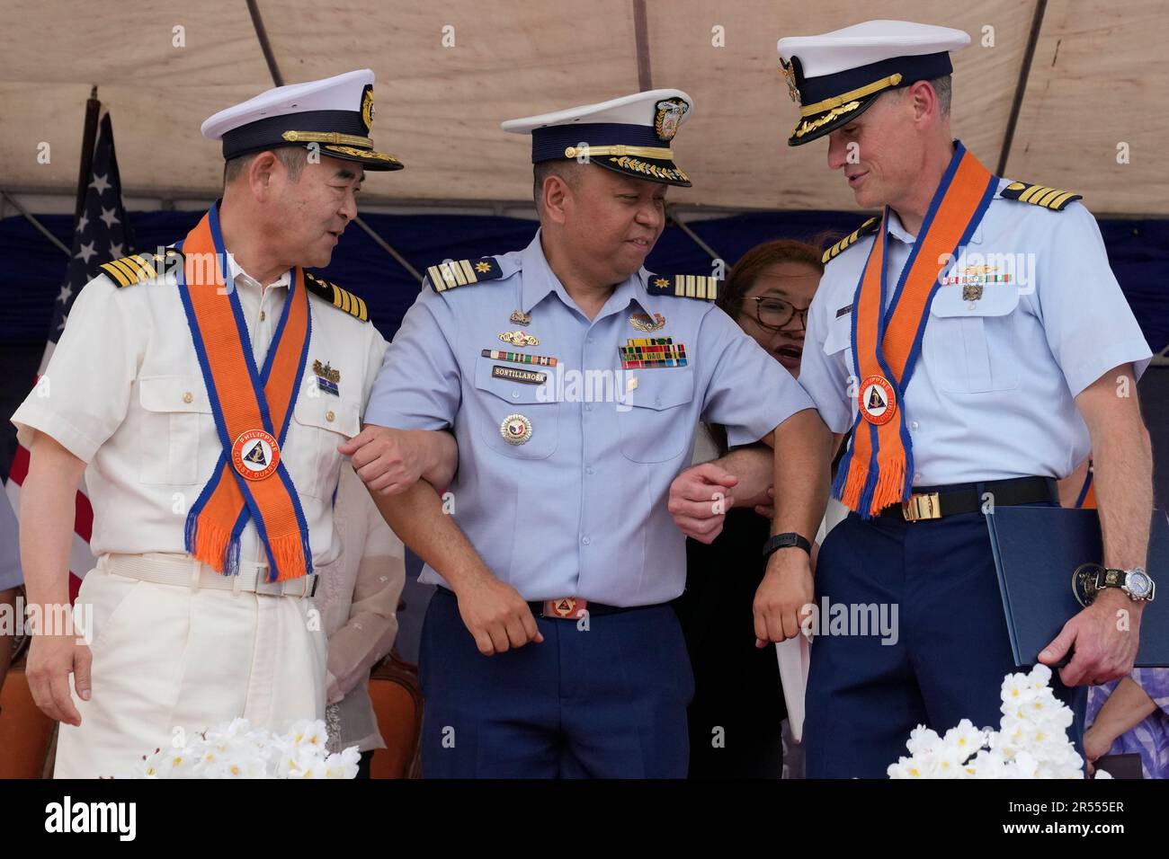 From left, Japanese Coast Guard Commanding Officer of Akitsushima ...