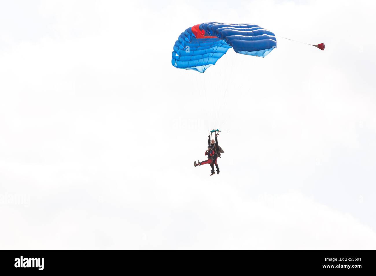 Skydiving. Tandem jump. An amazing adventure into the sky Stock Photo ...