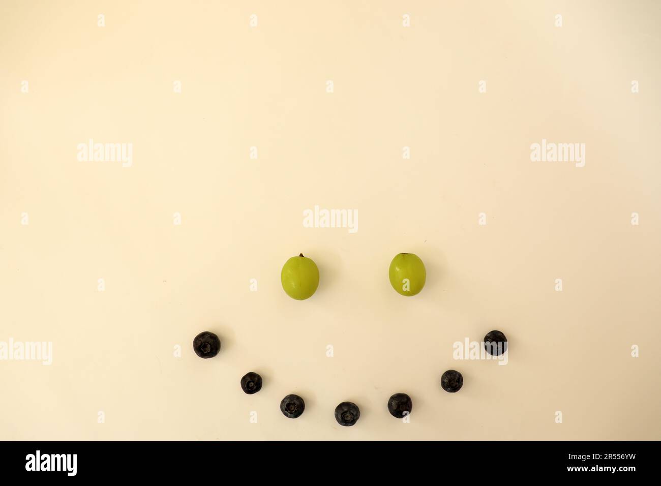 Smile Face of Grapes and Blueberries Stock Photo - Alamy