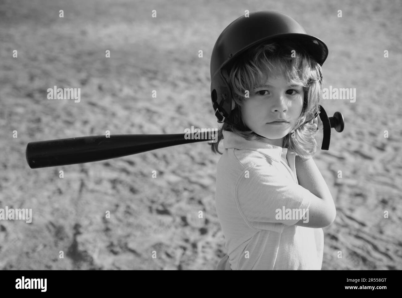 Kid holding a baseball bat. Pitcher child about to throw in youth ...