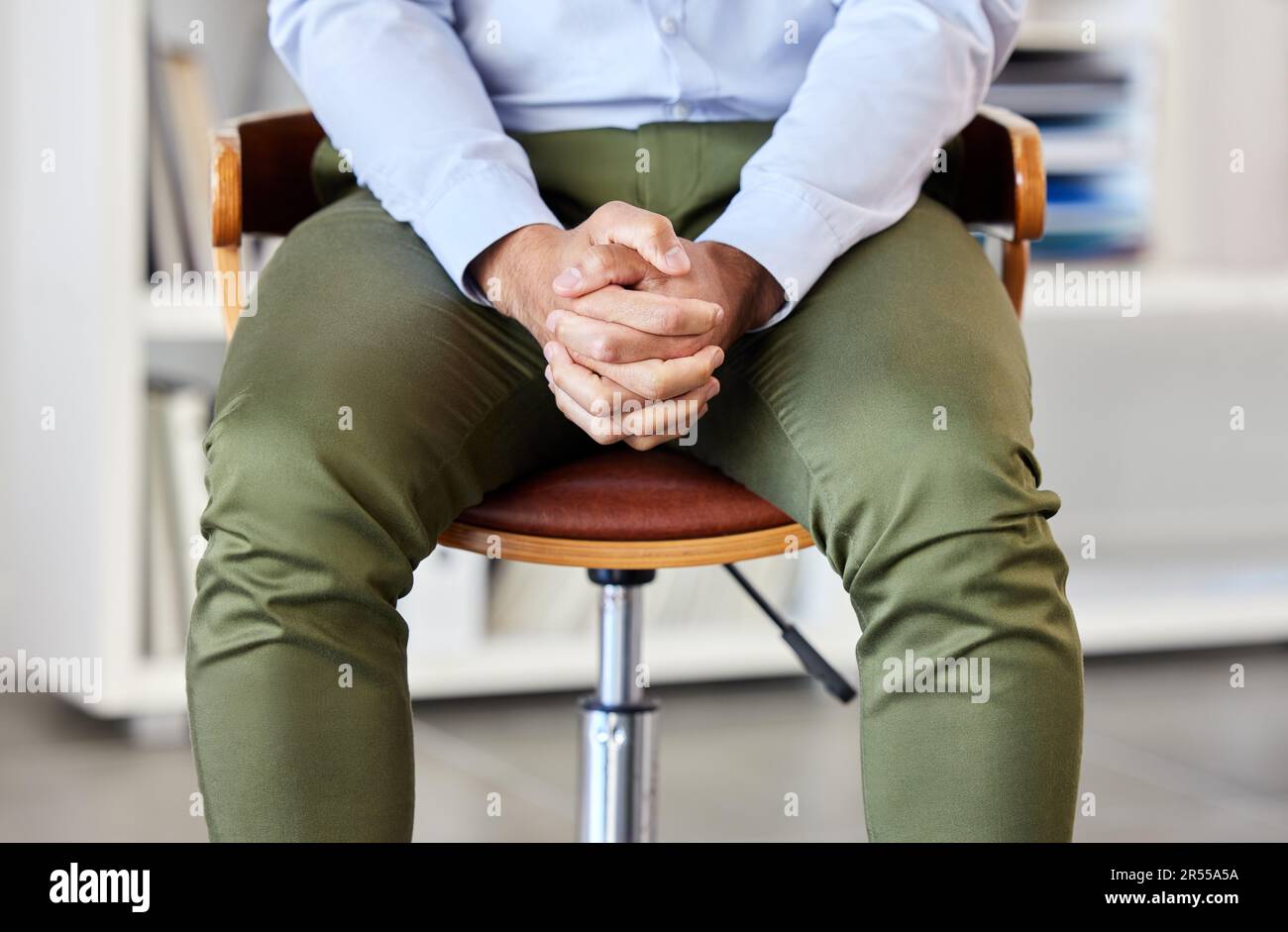 Hands, clasped and person waiting or anxious due to fear, stress or ...