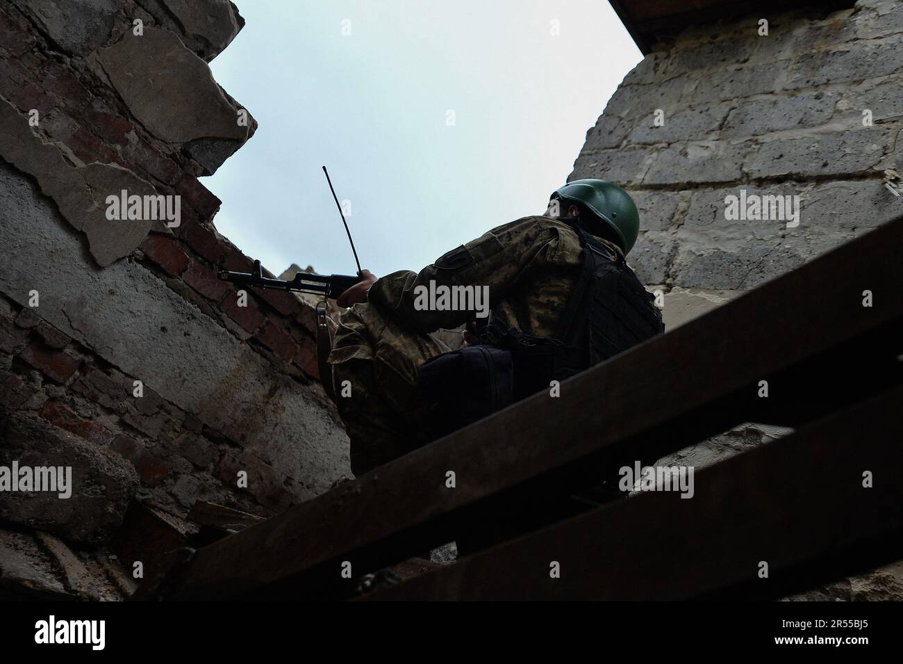 Kyiv, Donetsk Oblast, Ukraine. 31st May, 2023. A young soldier stands ...