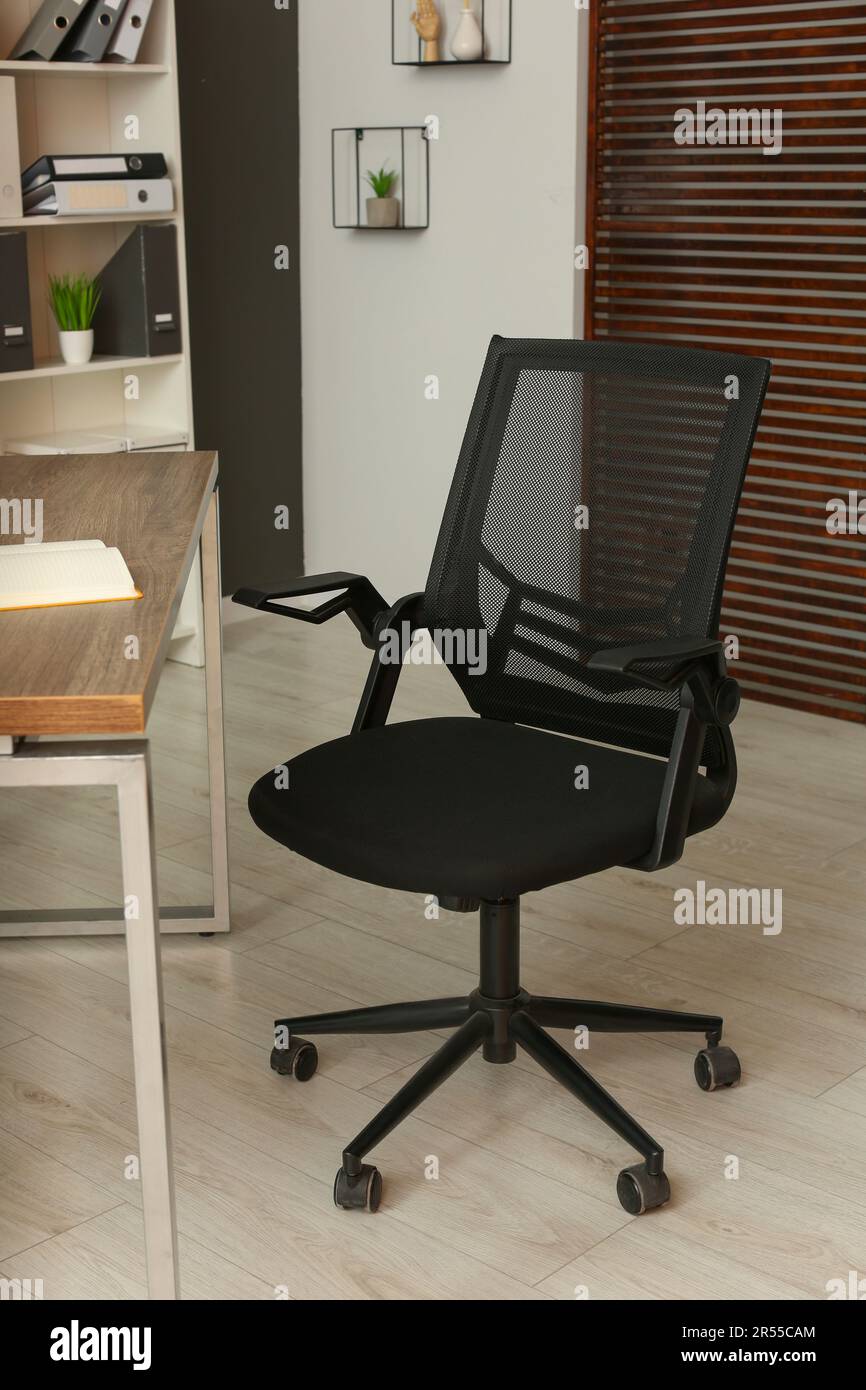 Stylish office chair at workplace in room. Interior design Stock Photo ...