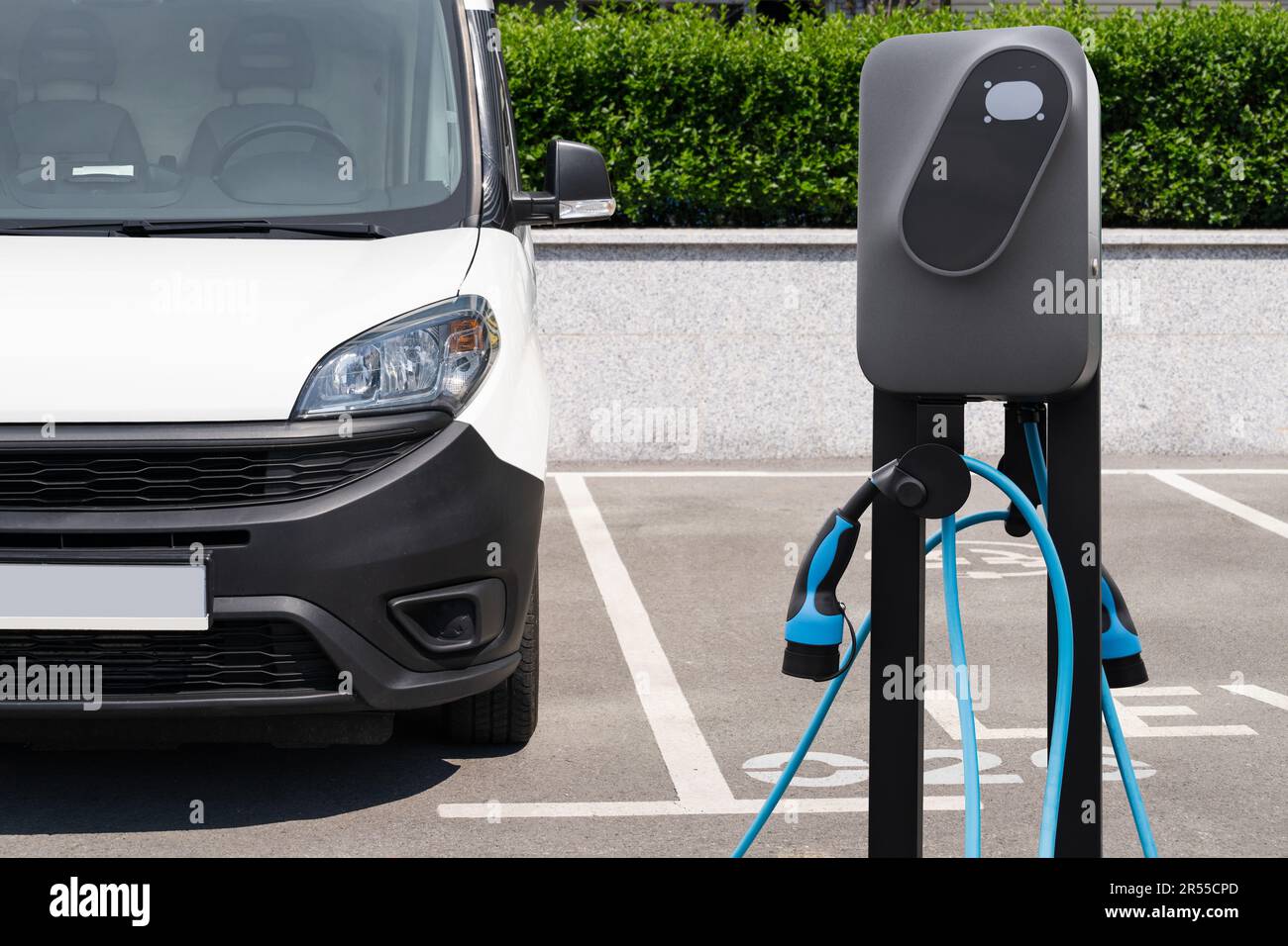 Electric delivery van with electric vehicles charging station. High ...
