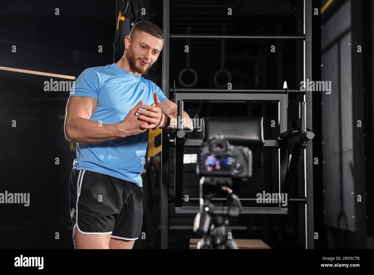 Man recording online training on camera at gym. Fitness coach Stock ...