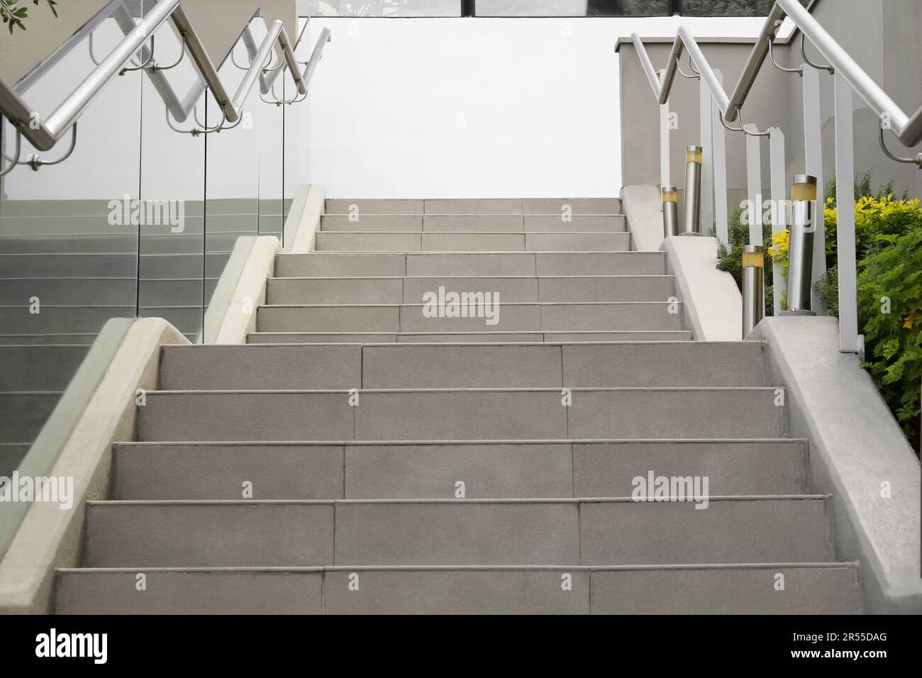 Outdoor staircase with metal handrails on city street Stock Photo - Alamy