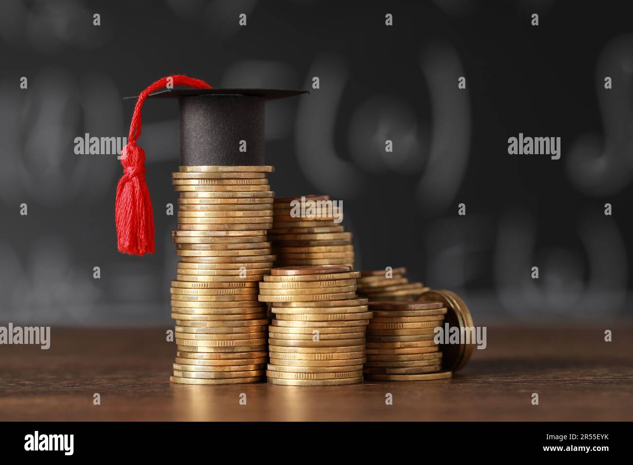 Graduation cap on stack money hi-res stock photography and images - Alamy