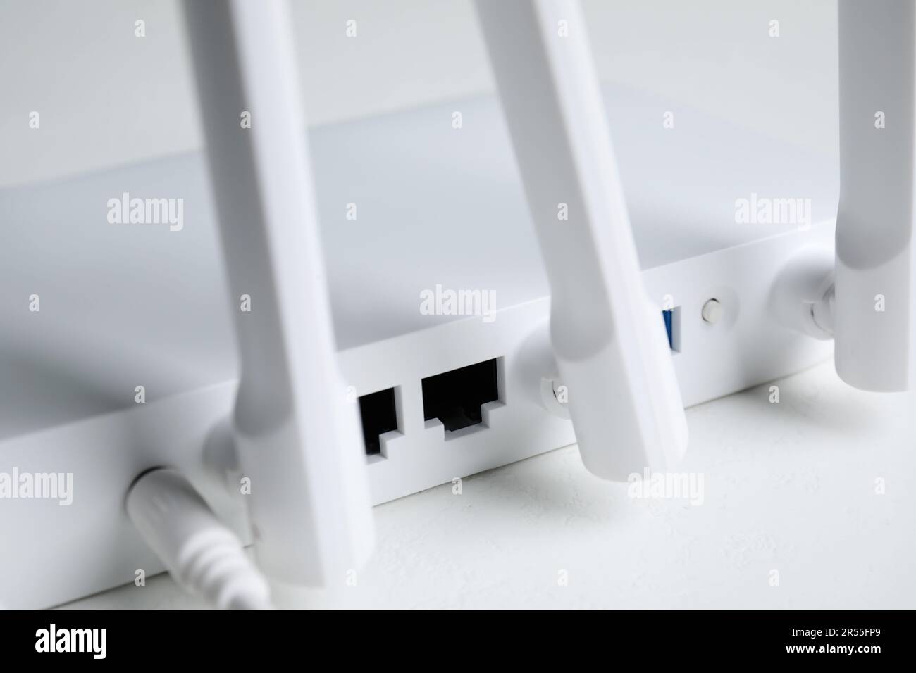New modern Wi-Fi router on white table, closeup Stock Photo - Alamy