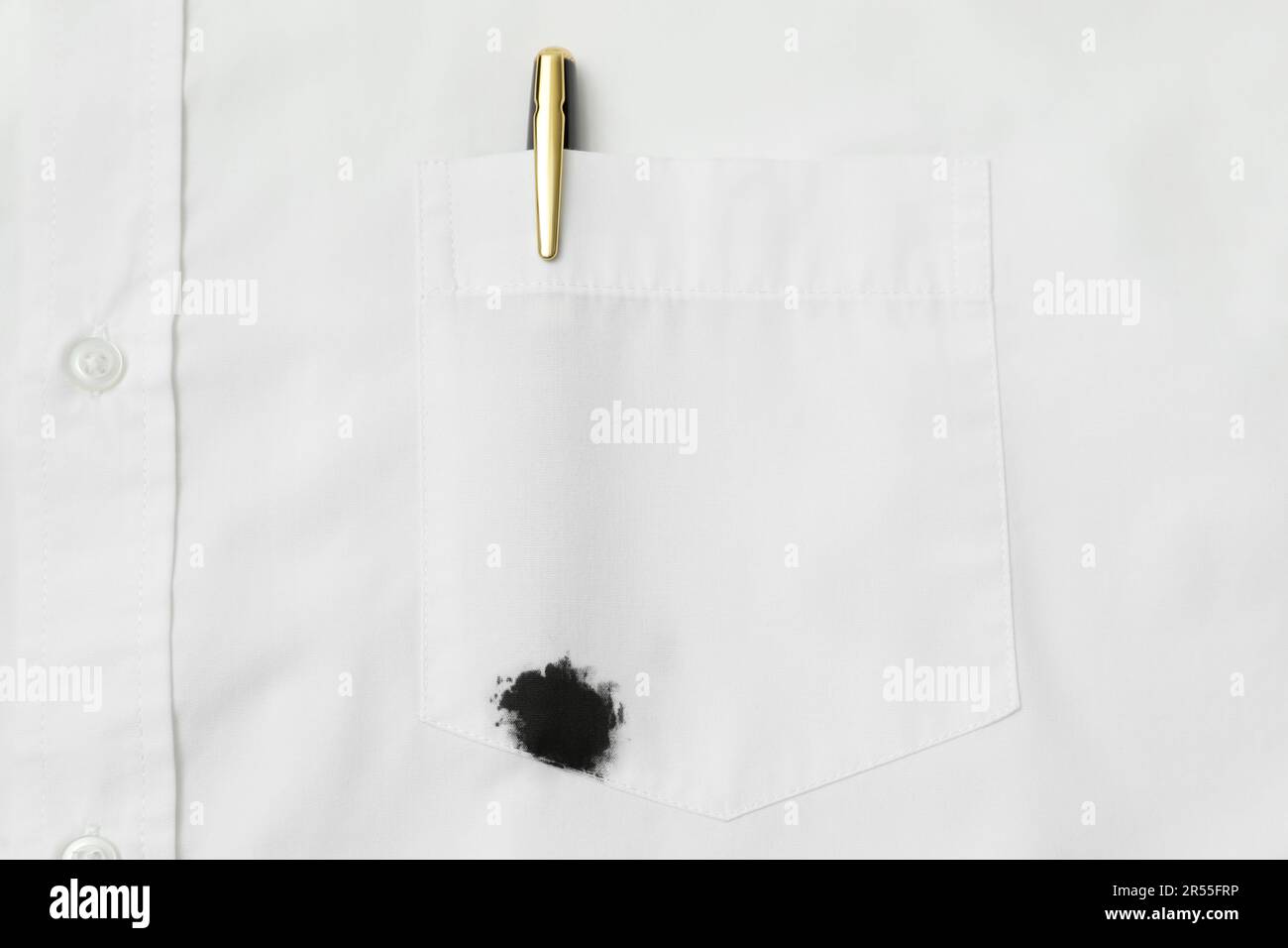 White shirt with stain of black ink and pen in pocket, top view Stock ...