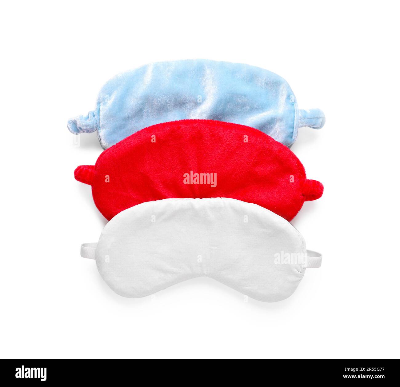 Three soft sleep masks isolated on white, top view Stock Photo - Alamy