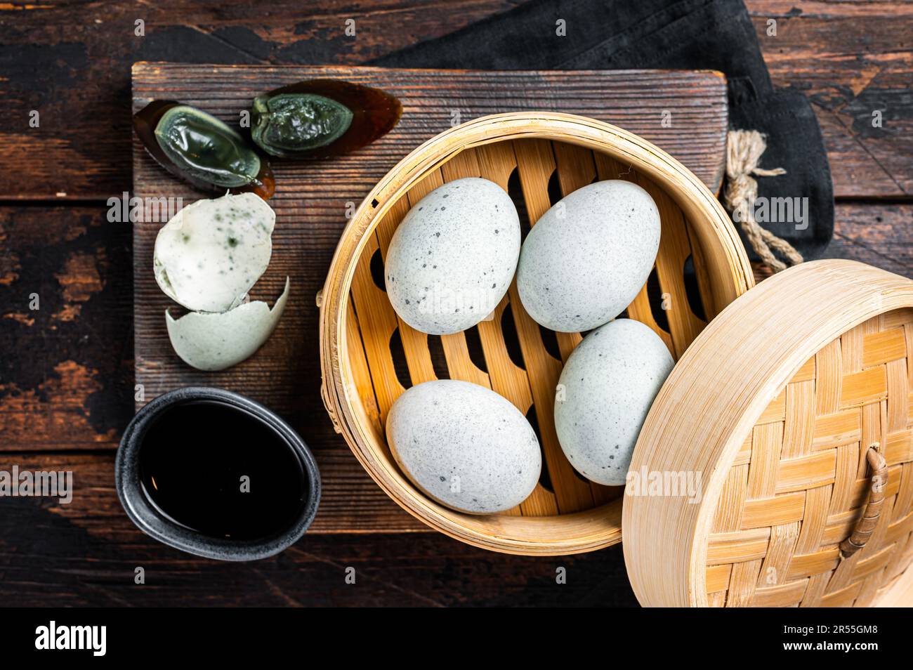 Black Century eggs, preserved duck egg, Chinese cuisine. Wooden ...