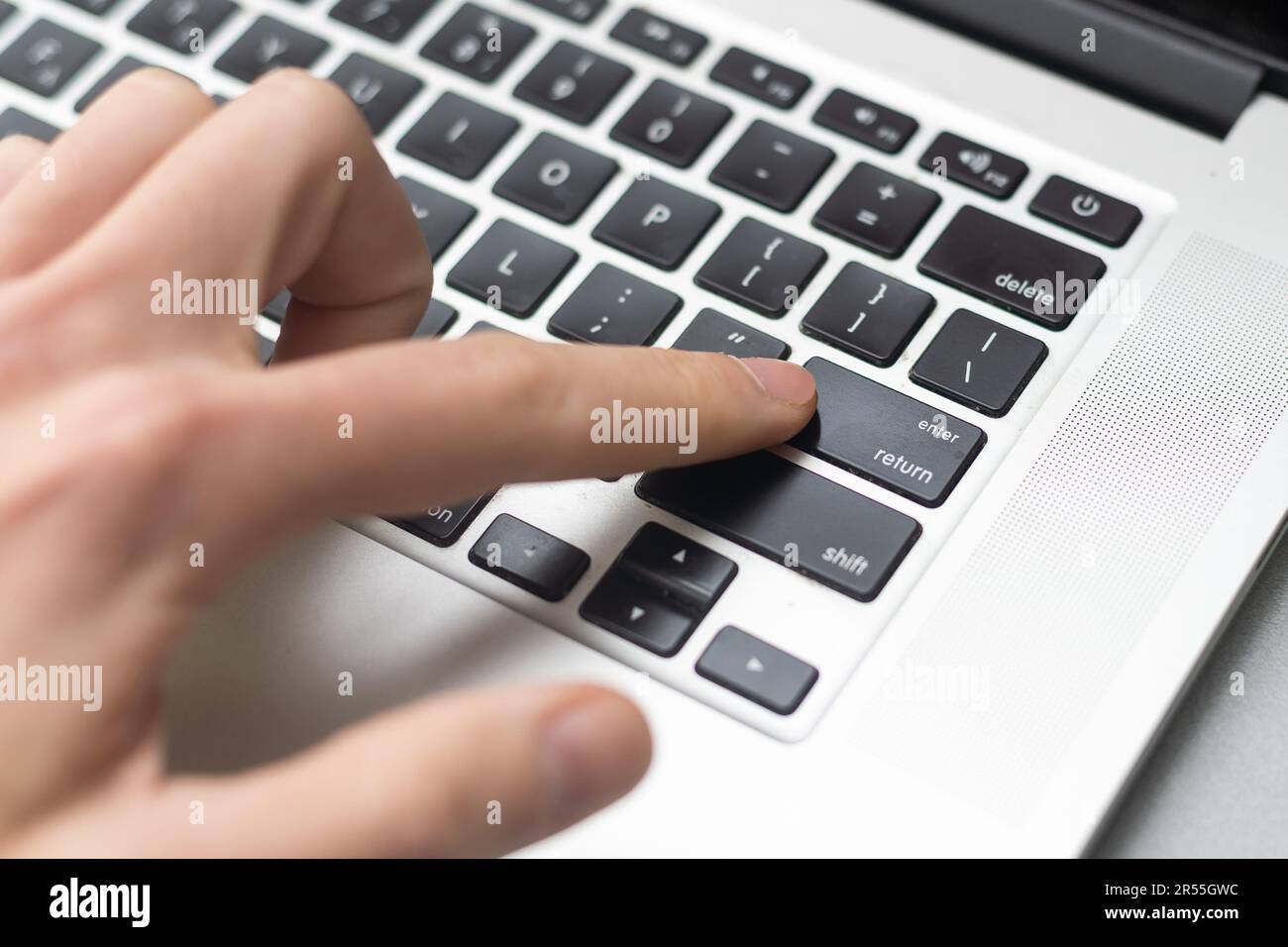 Pressing enter button on the computer keyboard Stock Photo - Alamy