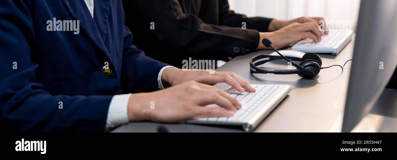 Panorama focus headset on call center workspace desk with blur ...