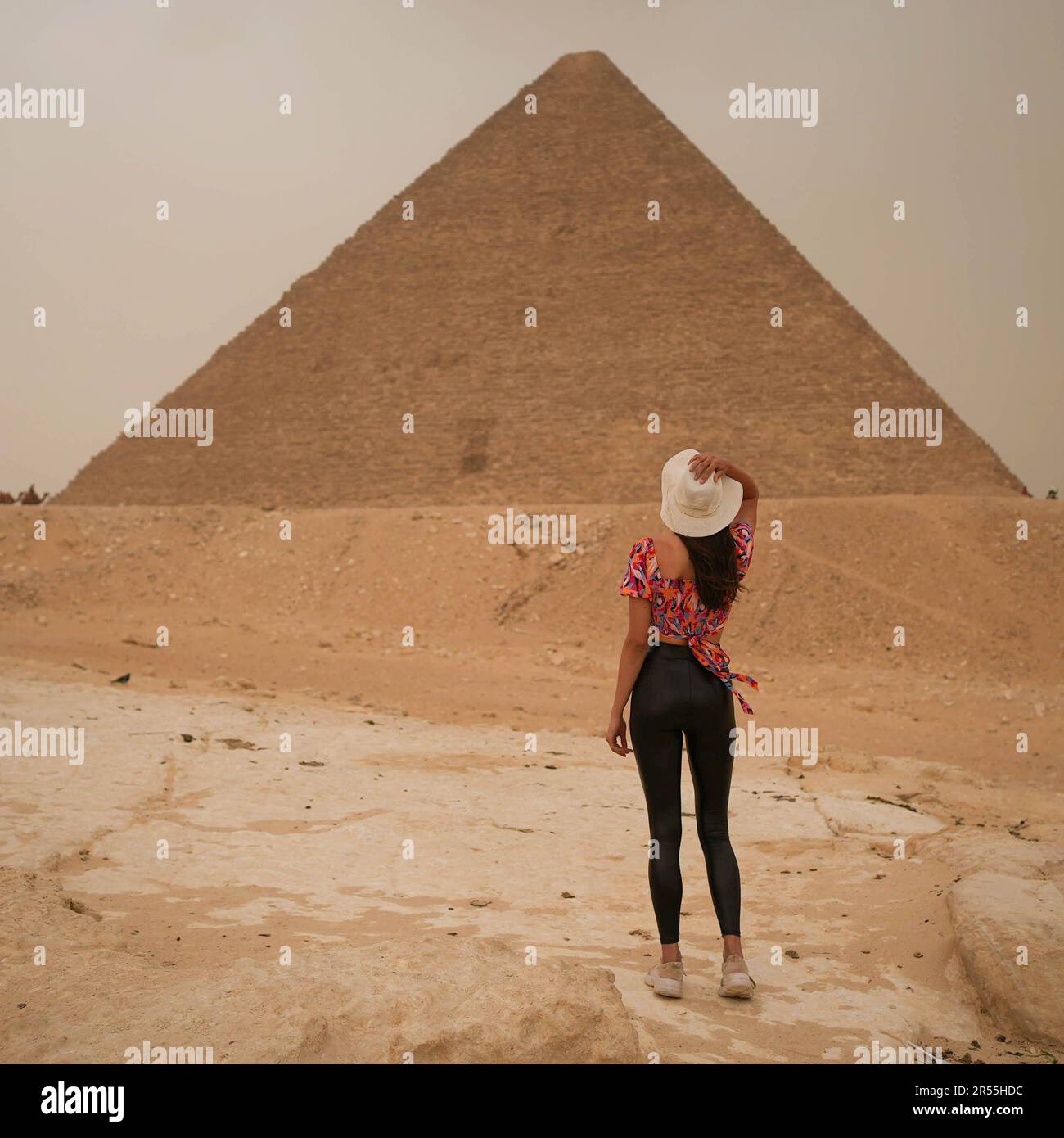 Young Beautiful Tall Girl in front of the Egyptian pyramid of Giza in ...