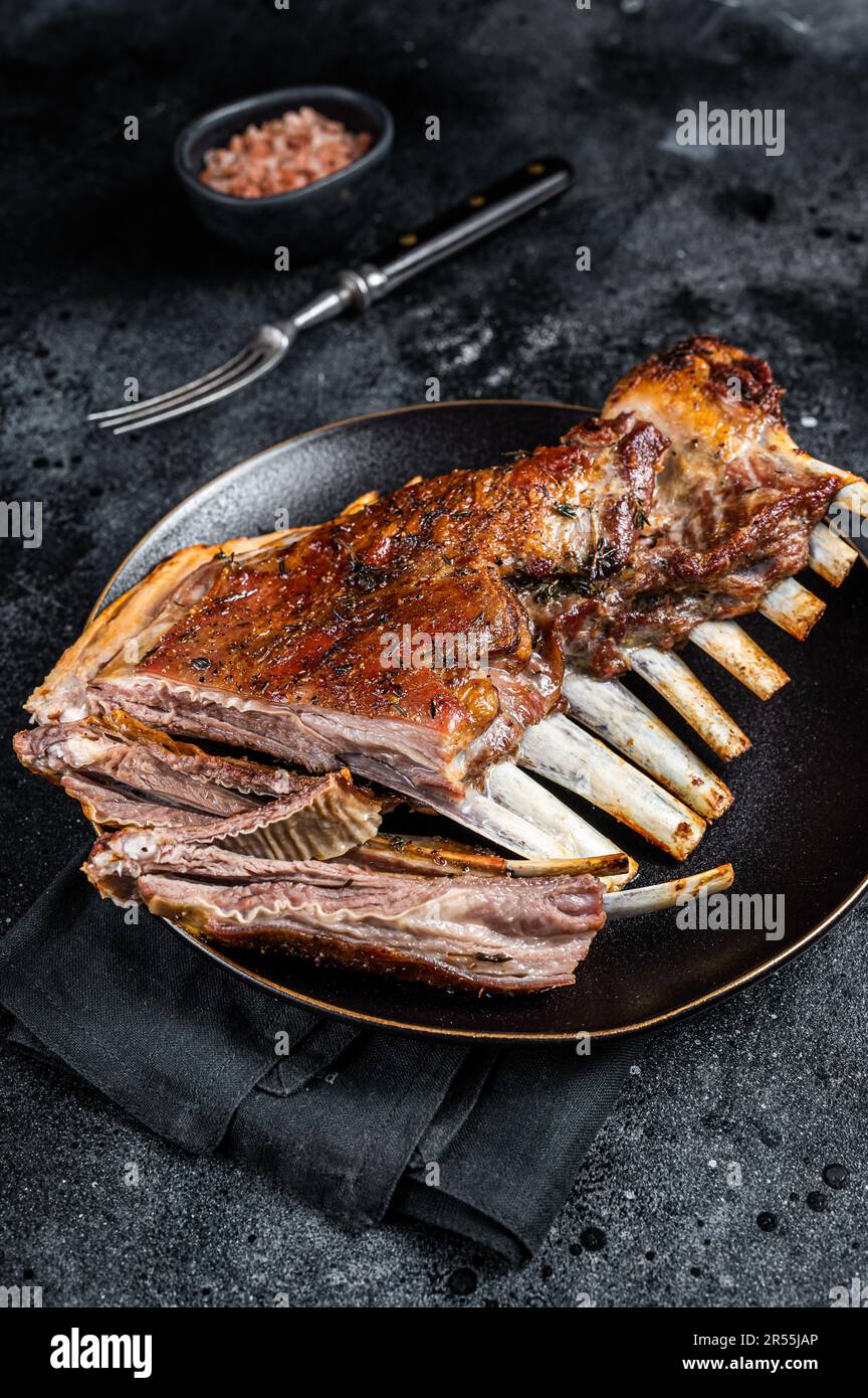 Roasted Rack of lamb ribs, mutton spareribs, sliced meat on plate ...