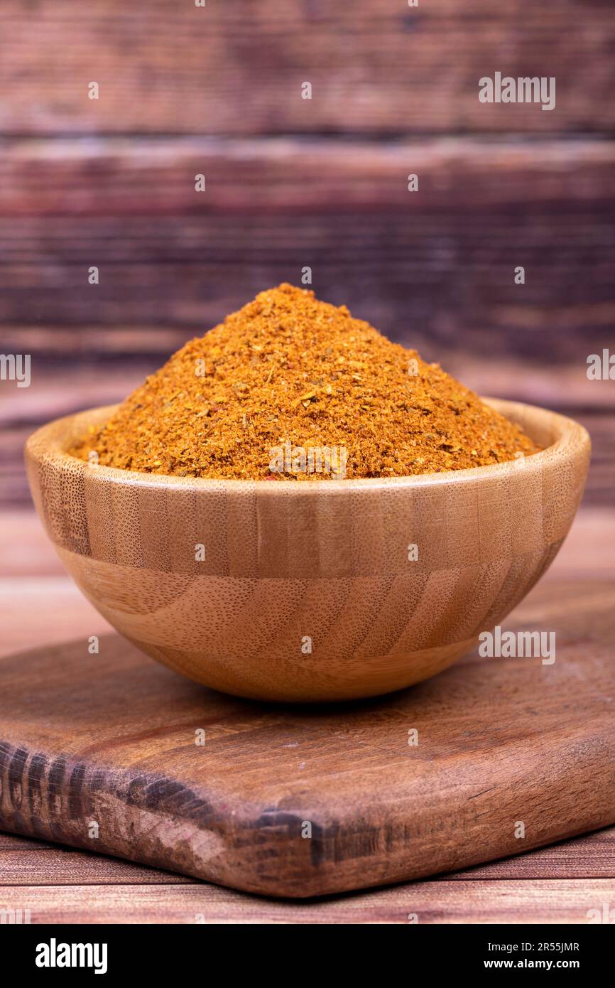 Cajun spice powder on wooden background. Powdered dried cajun in wooden ...