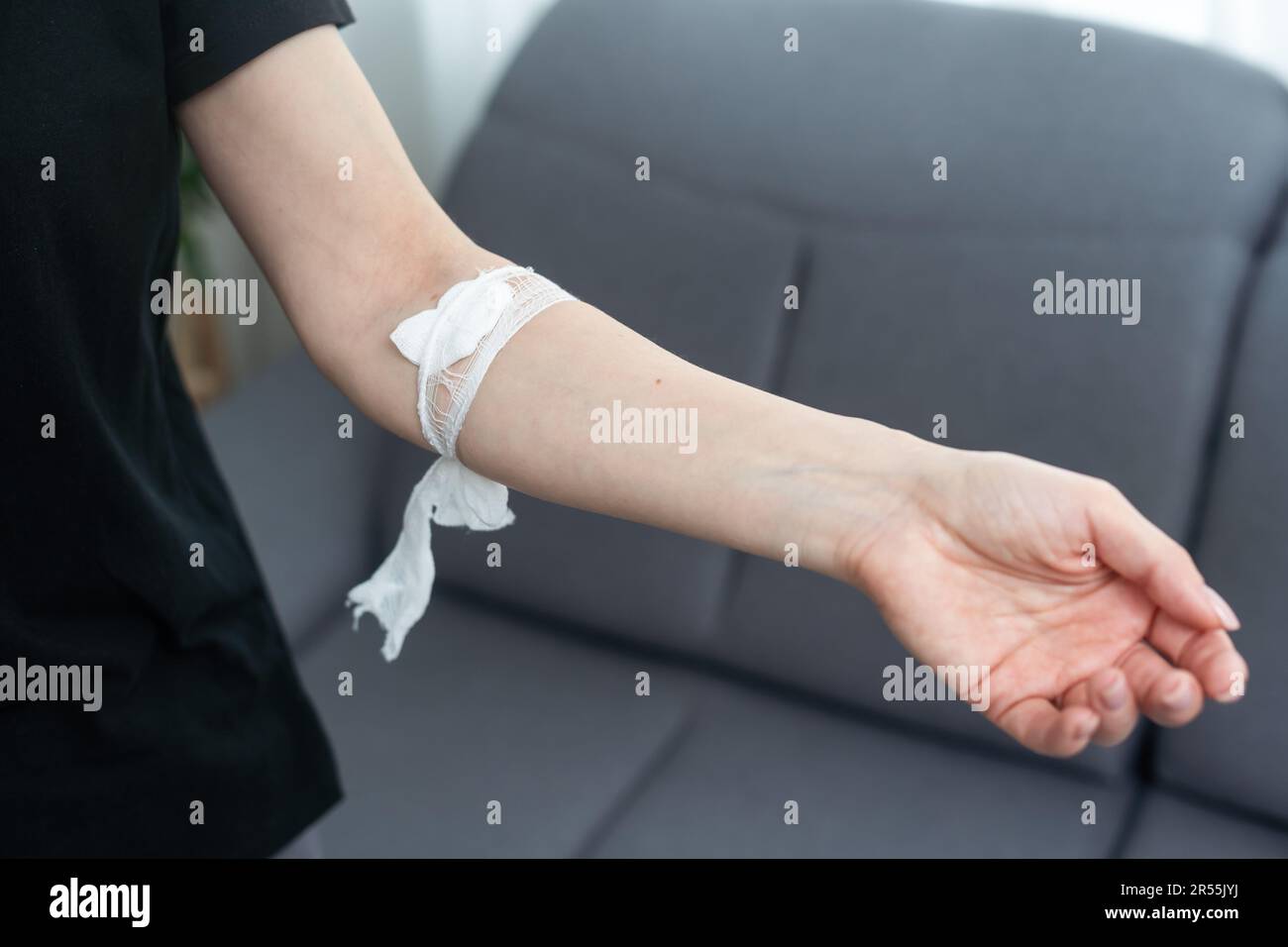 Adhesive plaster on the woman hand. Hand after donating blood Stock ...
