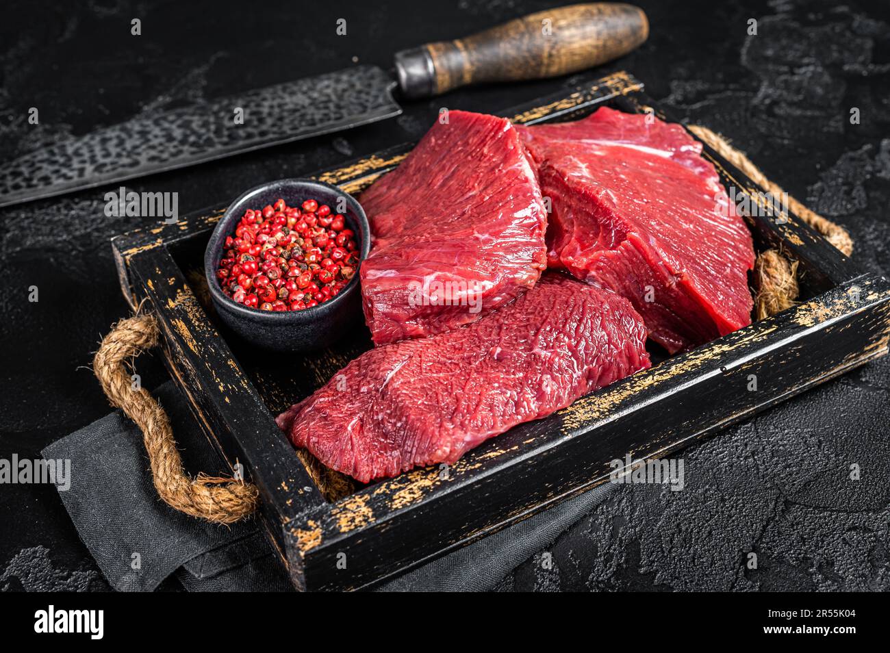 Uncooked Raw Venison dear meat, game meat. Black background. Top view ...
